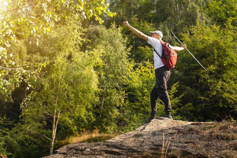 Man Hiking in the Mountains with a Backpack Stock Photo - Image of ...