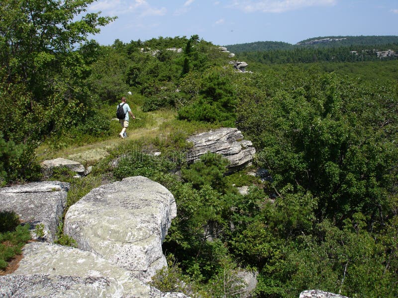 Man hiking via cliff edge stock image. Image of edge, trail - 1037209