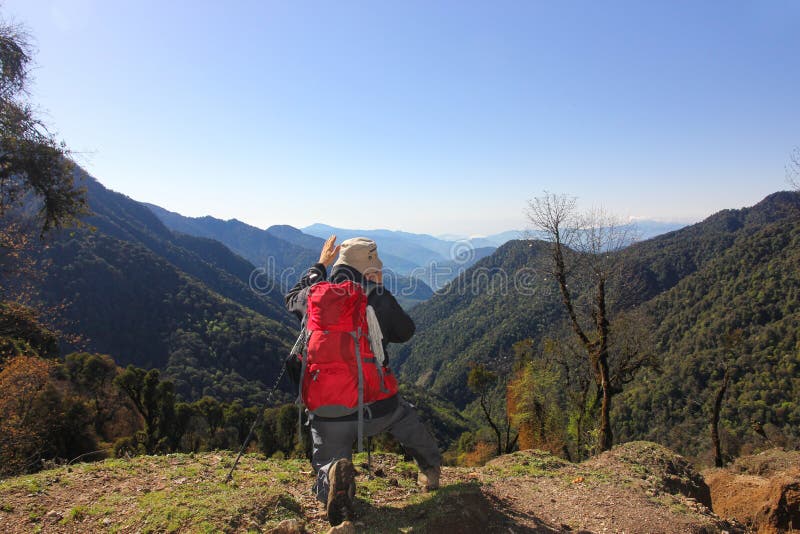 Man with His Back To the Camera and Photographs Nature and Mountains ...