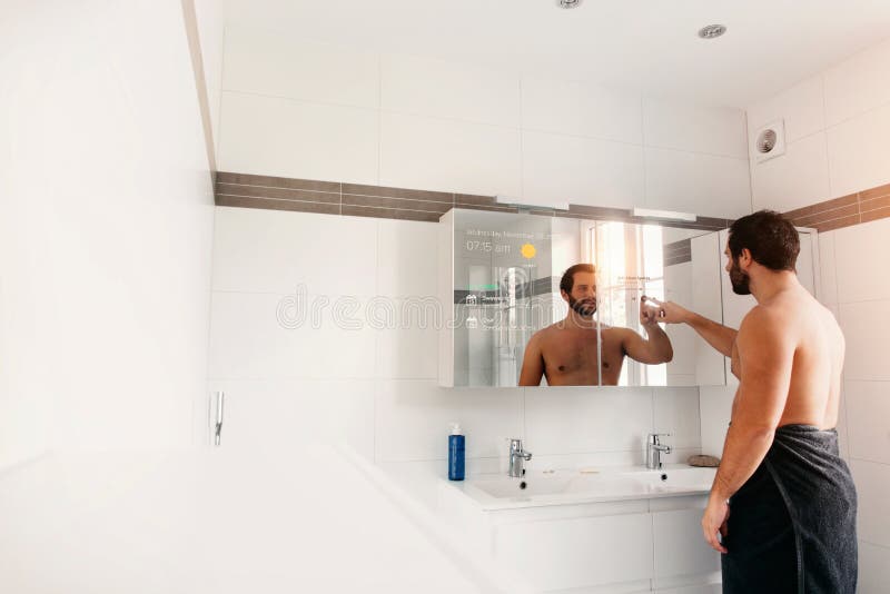 Man in His Bathroom Touching His Smart Mirror Stock Image - Image of ...