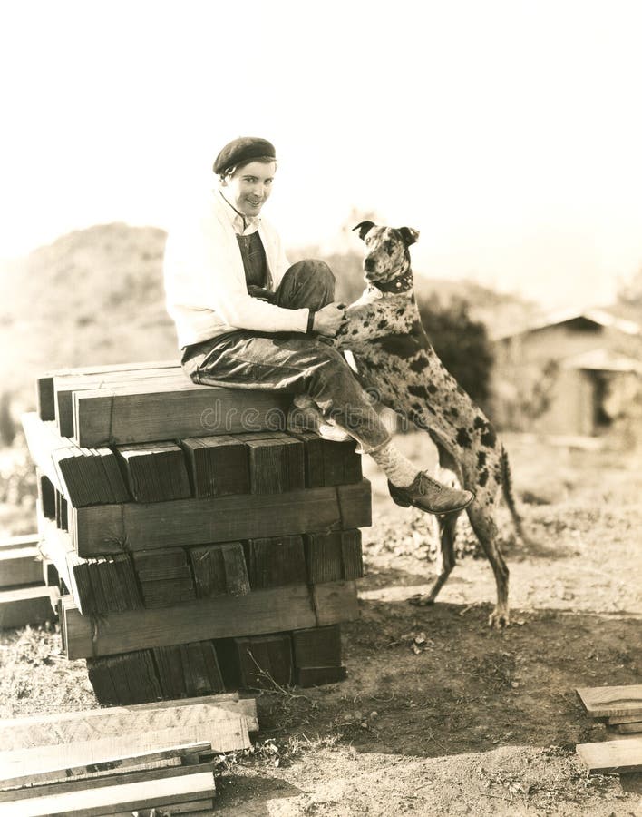 A Man and His Dog Take a Break Stock Image - Image of adult, leisure ...