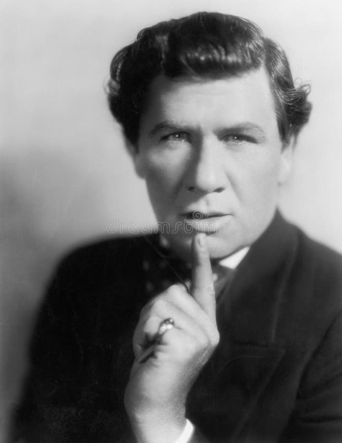 Man with His Finger on His Chin Looking Quizzical Stock Image - Image ...