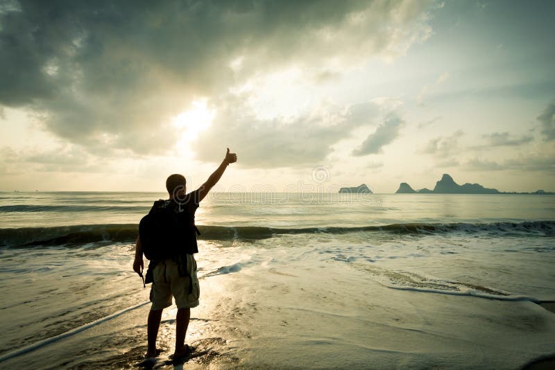 Man His Hand Up Dawn Beach Stock Photos - Free & Royalty-Free Stock ...