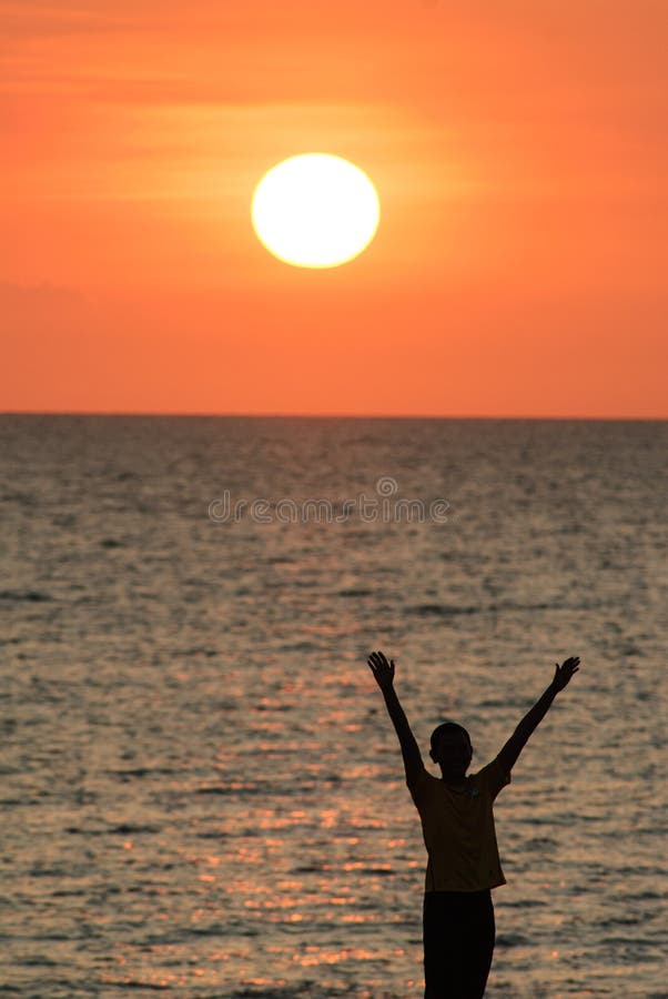 Man with His Hands Up Watching the Sun Set Stock Image - Image of black ...