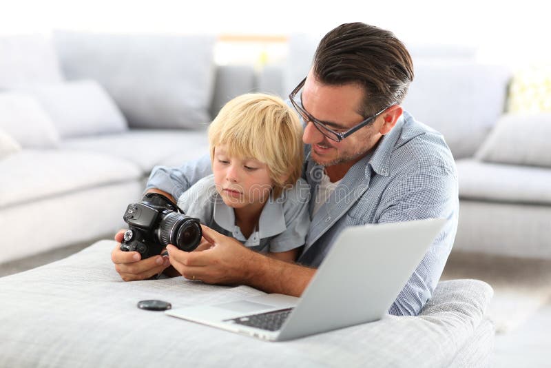 Man and His Little Son Playing with Camera Stock Image - Image of ...