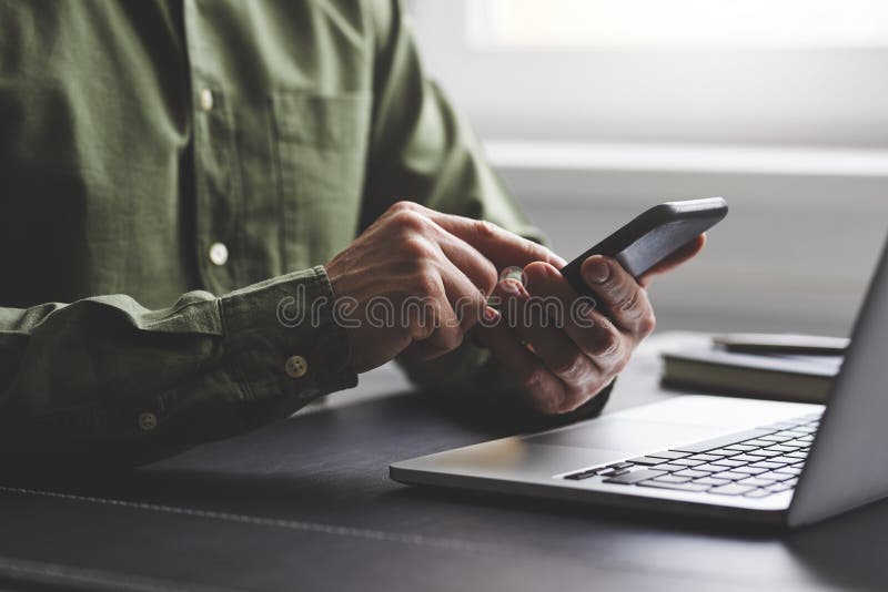 A Man with His Mobile Phone in the Office Stock Photo - Image of ...