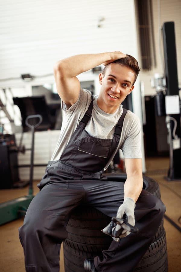 A Man at His Work at Autoservice during a Break Stock Image - Image of ...