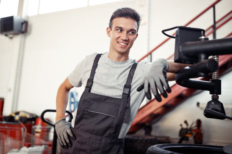 A Man is at His Work in a Car Repair Service during a Break Stock Image ...