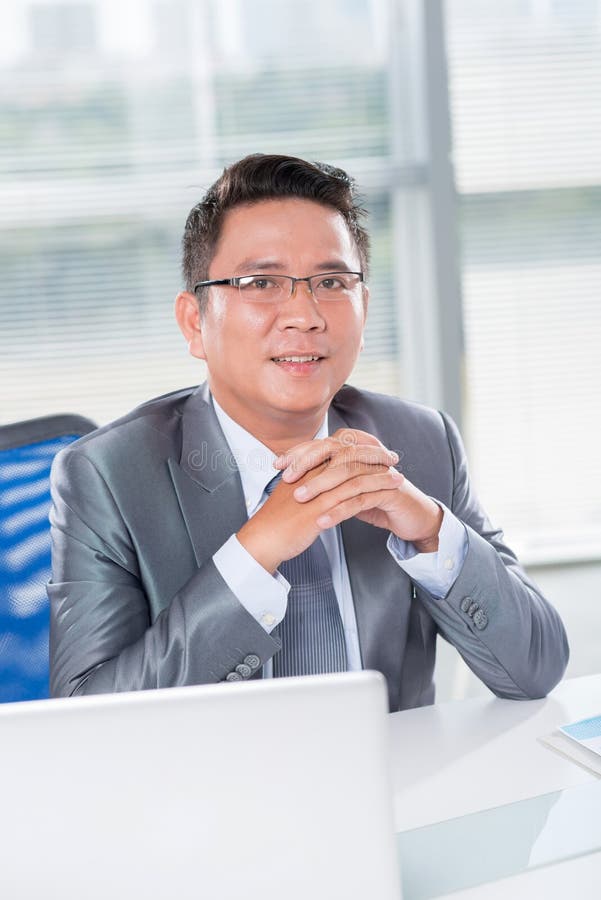 Man at his workplace stock image. Image of confidence - 46499529