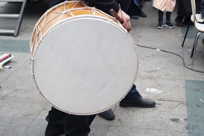 A Man Hit the Ancient Drum with Musical Instrument. Stock Photo - Image ...