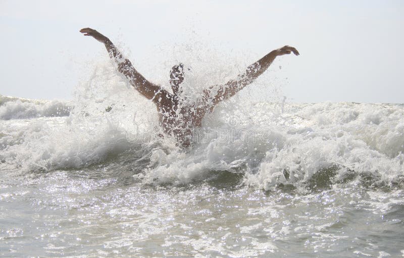 Man hit by waves stock image. Image of hitting, huge - 21097711