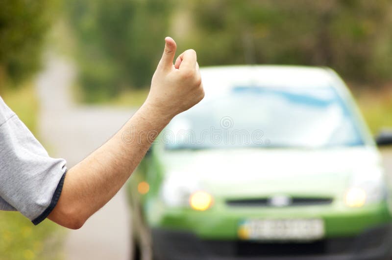 Man hitching on road stock image. Image of outside, hitchhiker - 10680829
