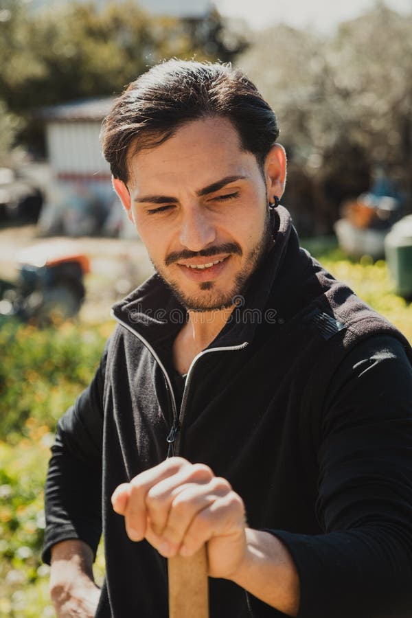 Man Rests with His Hand Resting on the Hoe Stock Image - Image of rural ...