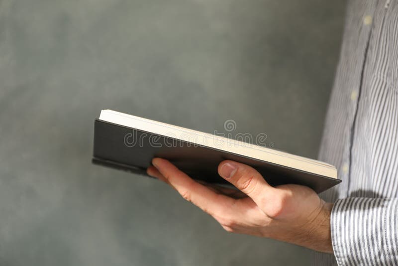 Man hold book in hands stock photo. Image of prayer - 144573564