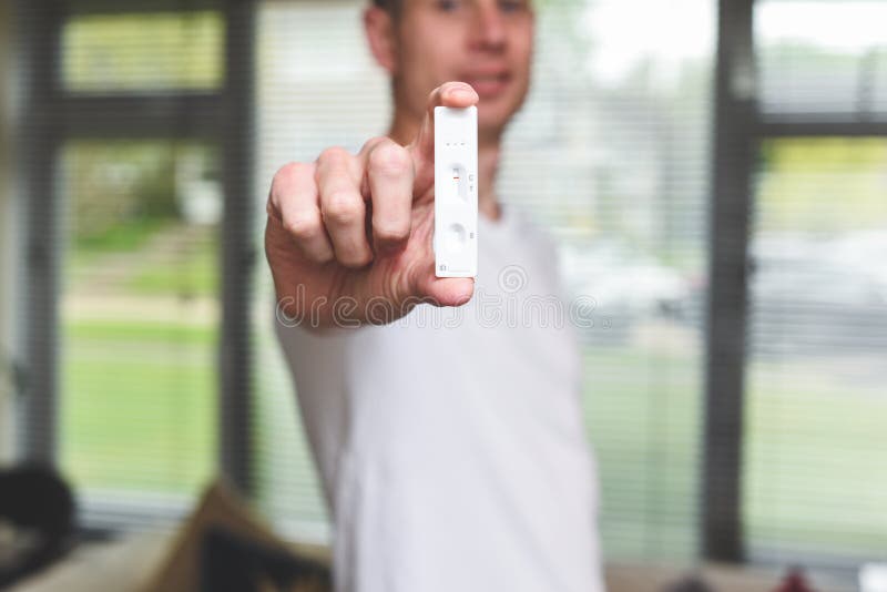 Man Hold a Covid-19 Home Testing Kit Showing a Negative Result for ...