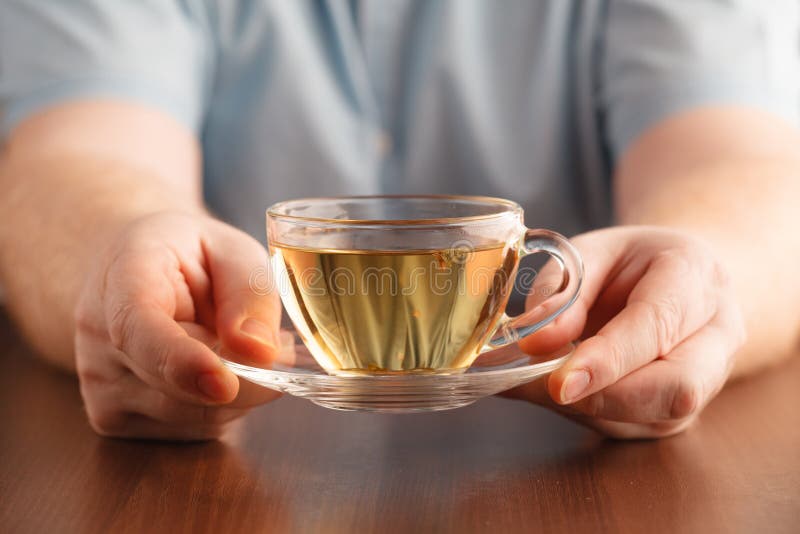 Man Hold Cup in Hand and Offer Tea Stock Image - Image of beverage ...