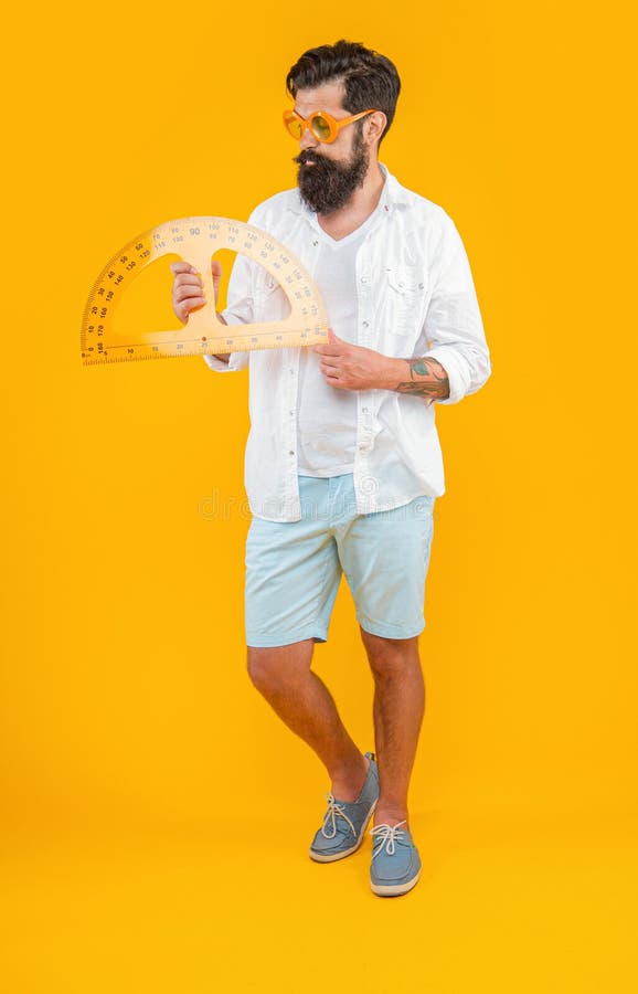 Man Hold Geometry Protractor Isolated on Yellow. Man Hold Geometry ...