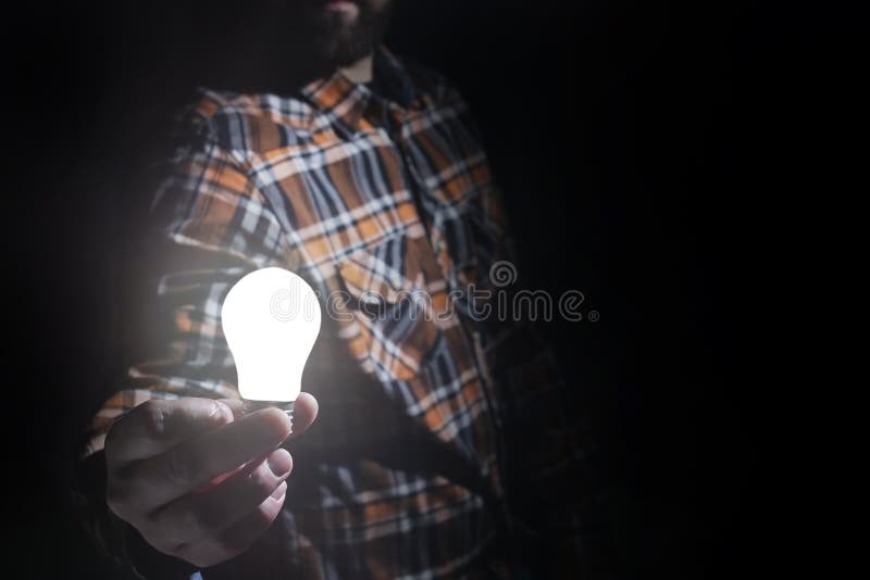 Man hold glow lamp in hand stock photo. Image of creative - 89482832