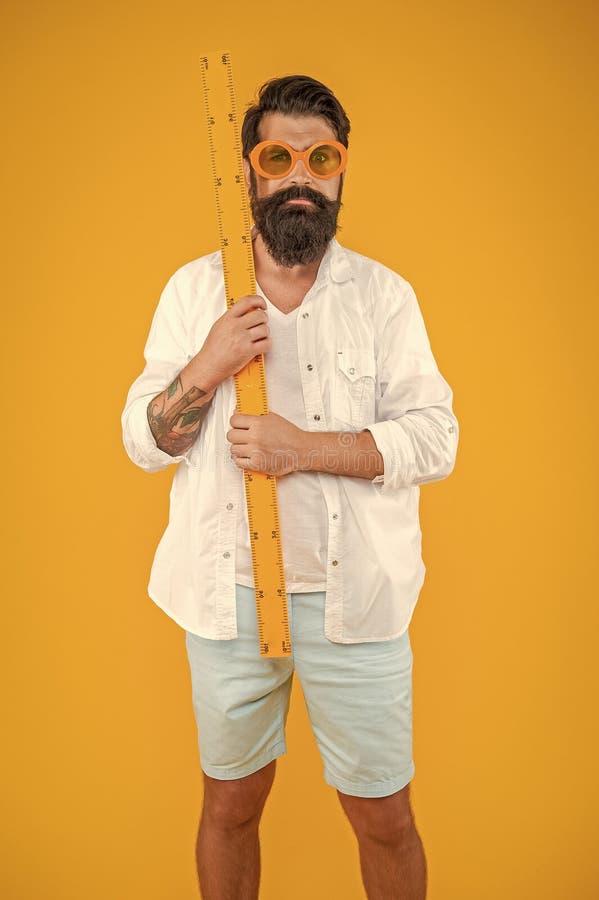 Man Hold Measuring Ruler Isolated on Yellow. Man Hold Measuring Ruler ...