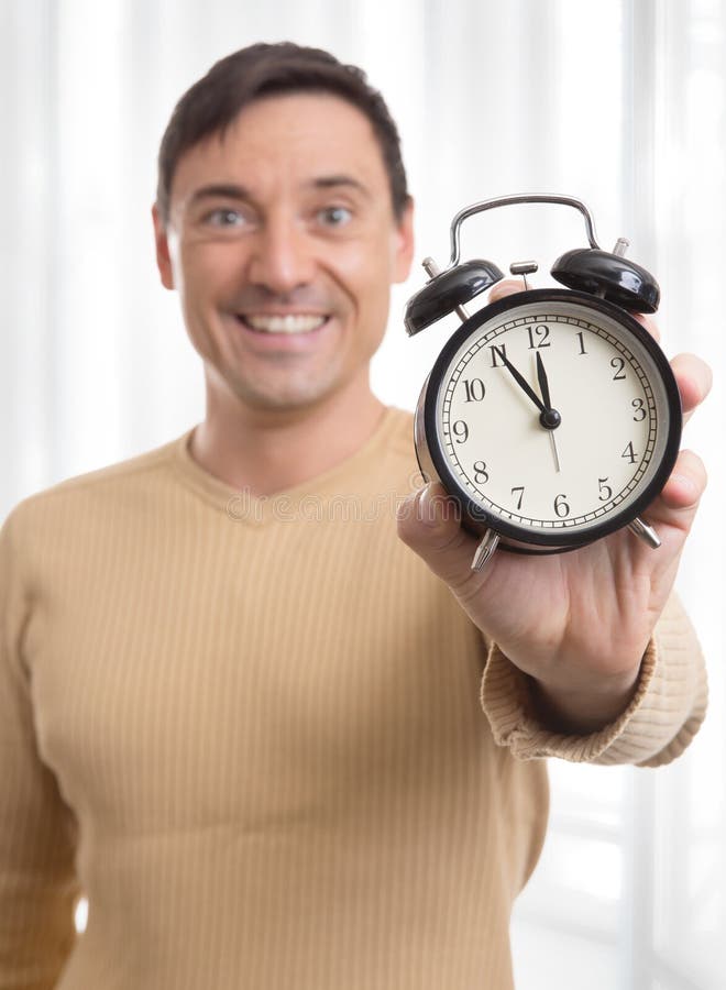 Man Holding Alarm Clock, Thinking and Looking Up Stock Photo - Image of ...