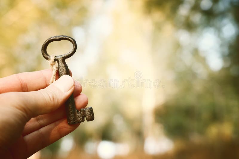 Man Holding an Ancient Key in the Forest Stock Photo - Image of concept ...