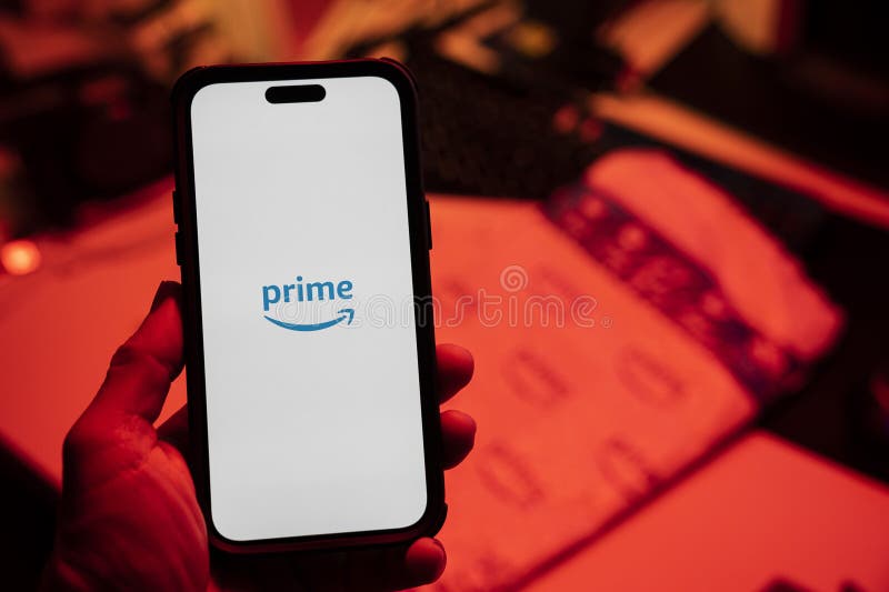 Man Holding an Apple IPhone 14 Pro Max Smartphone with Amazon Prime ...