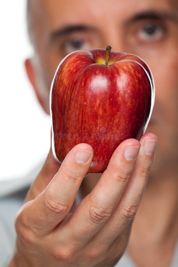 Man holding an apple stock photo. Image of adam, face - 63476398