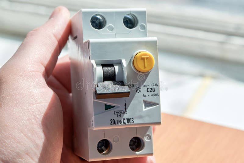 Man Holding an Automatic Switch of Differential Current. Stock Photo ...
