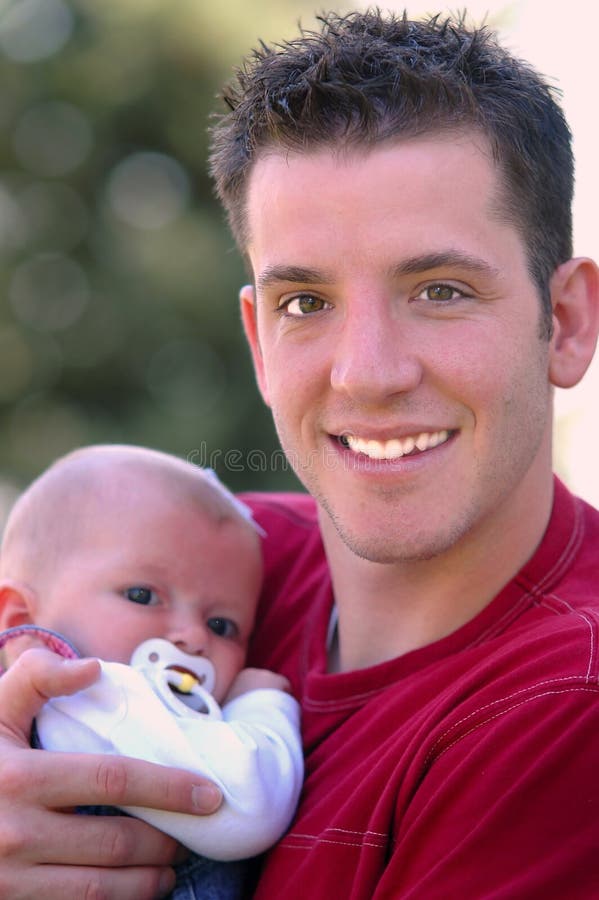 Man Holding a Baby stock image. Image of smile, happy - 1883469