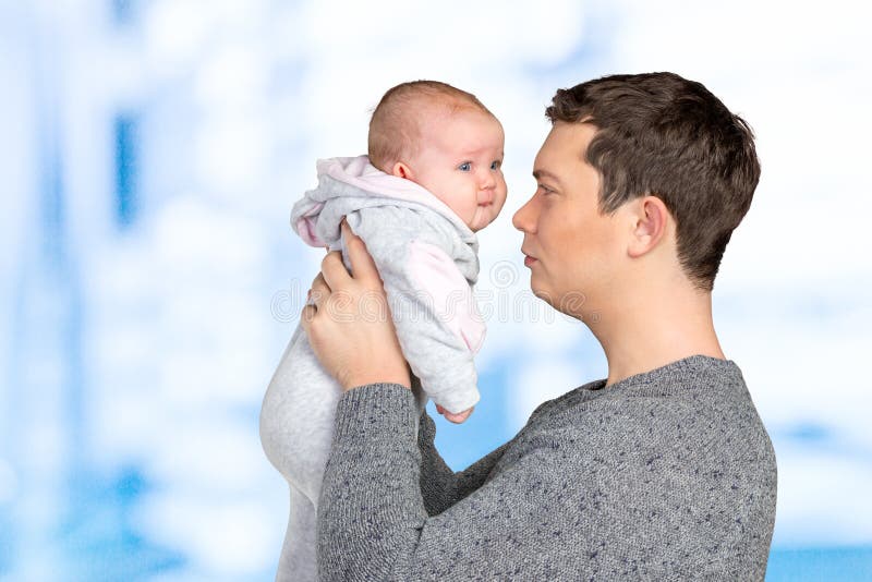 Man holding a baby stock image. Image of baby, offspring - 70079991
