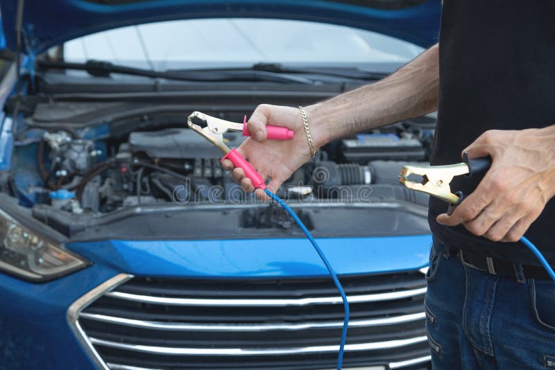 Man Holding Battery Cable for Charging the Car Stock Image - Image of ...