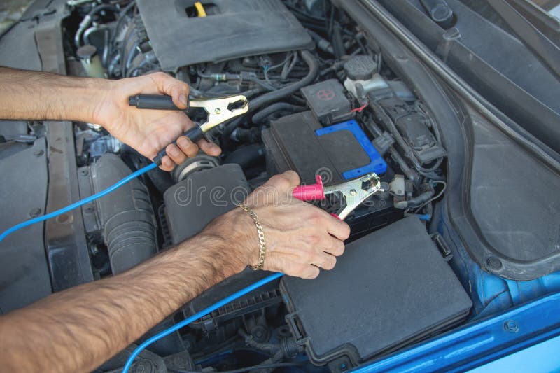 Man Holding Battery Cable for Charging the Car Stock Photo - Image of ...