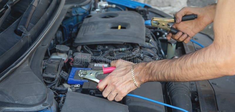 Man Holding Battery Cable for Charging the Car Stock Photo - Image of ...