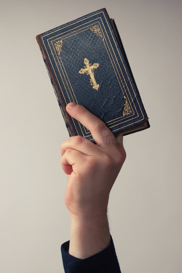 Man Holding a Bible in the Air Stock Image - Image of hand, religious ...
