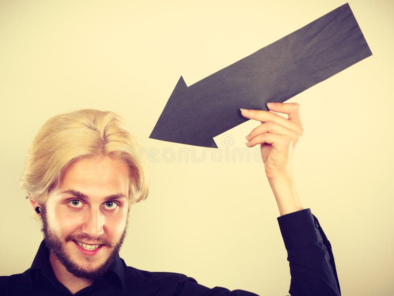 Man Holding Black Arrow Pointing at Himself Stock Image - Image of ...