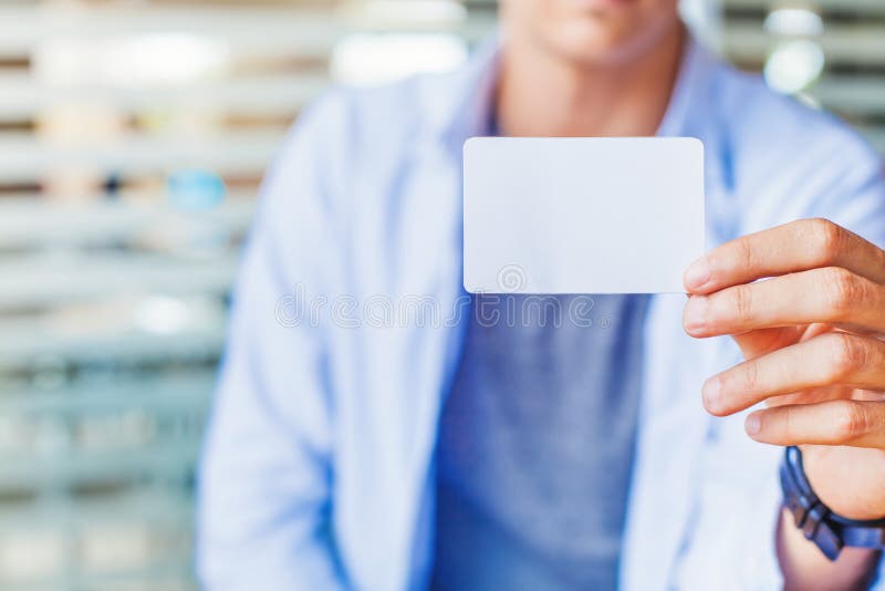 Man Holding Blank Name Card. Stock Photo - Image of human, badge: 79705830