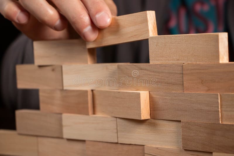Man Holding Blocks Wood Game Build Wall Stock Photos - Free & Royalty ...