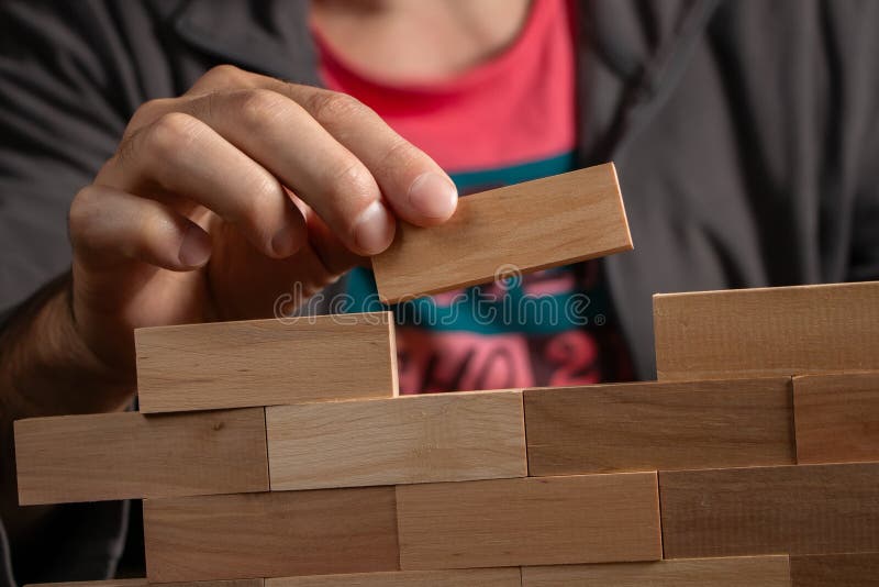 Man Holding Blocks Wood Game Build Wall Close Up Stock Photos - Free ...