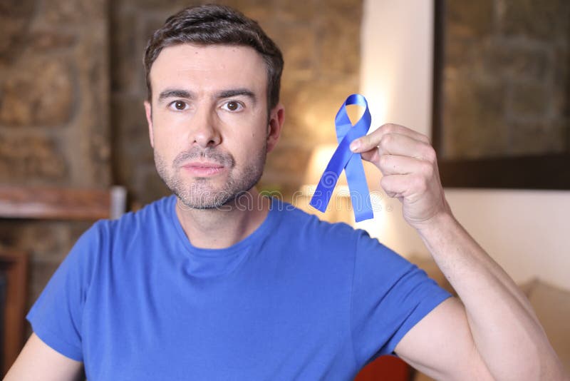 Man holding a blue ribbon stock photo. Image of health - 244757696