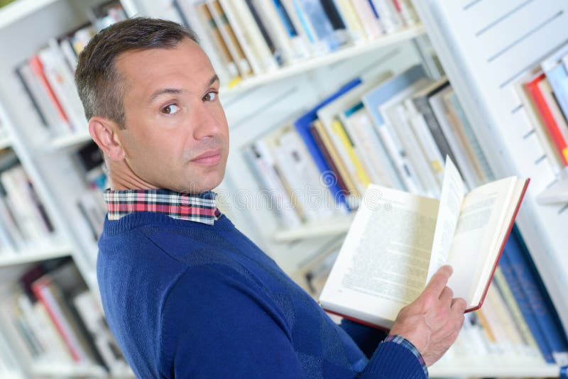 Man holding a book stock image. Image of comprehension - 120350723
