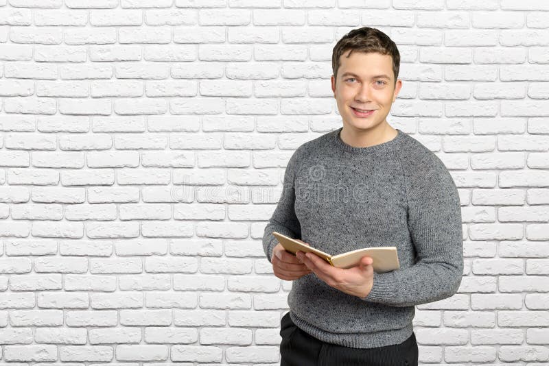 Man holding book stock photo. Image of beauty, college - 69887714