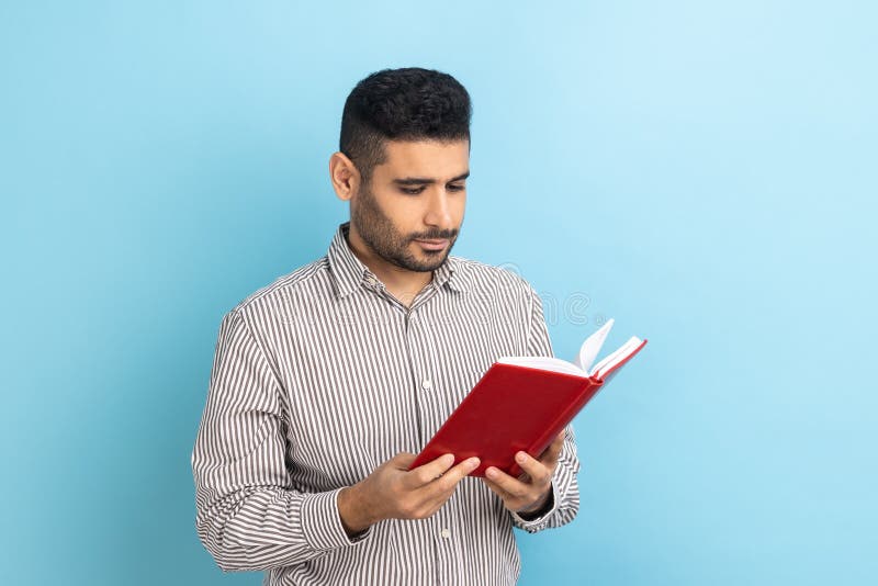 Man Holding Book and Reading, Standing Absorbed with Exciting Plot ...