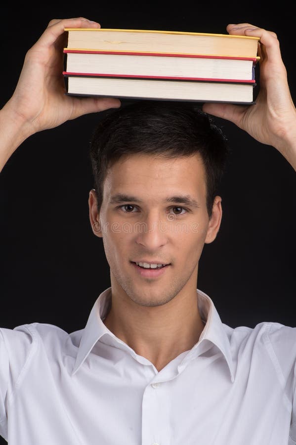 Man Holding Books on Black Background. Stock Photo - Image of male ...