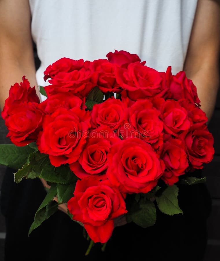 Man Holding Bouquet of Red Roses Stock Photo - Image of flora, lovely ...