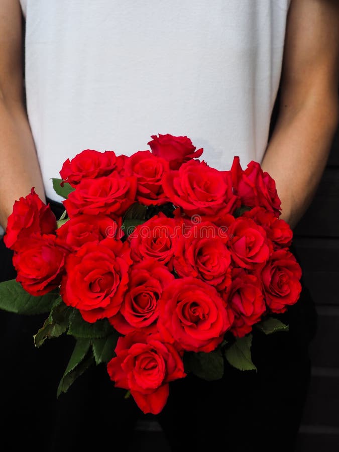 Man Holding Bouquet of Red Roses Stock Photo - Image of floral, gift ...