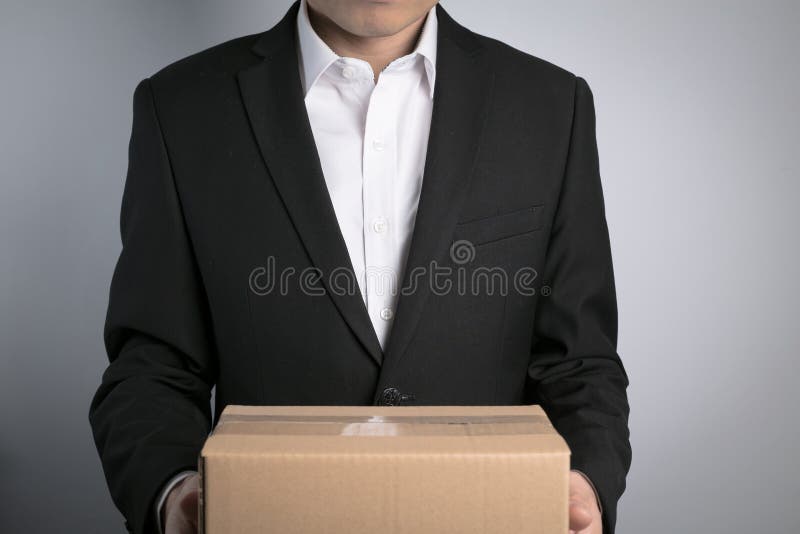 Man holding a box stock photo. Image of businessman - 113779306
