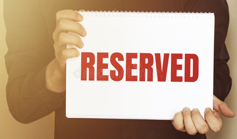 Man Holding Brochure with RESERVED Text on Grey Background. Mock Up for ...