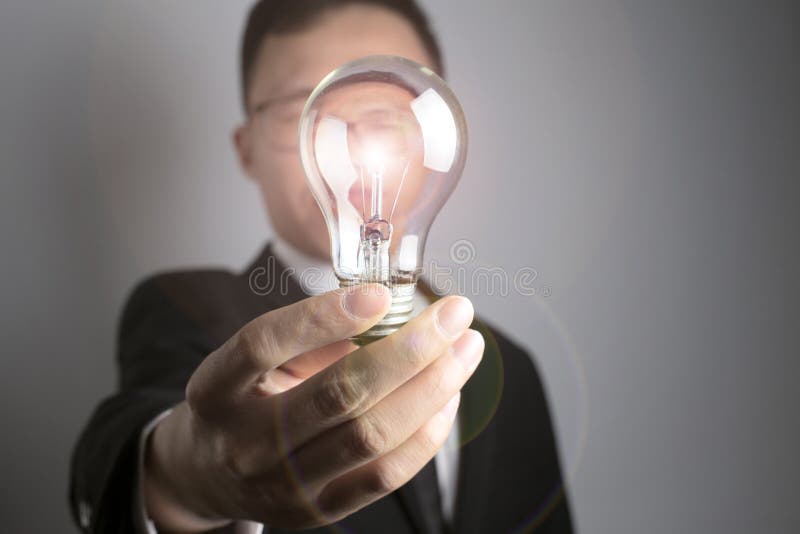 Man holding a bulb stock photo. Image of lightbulb, power - 101730800