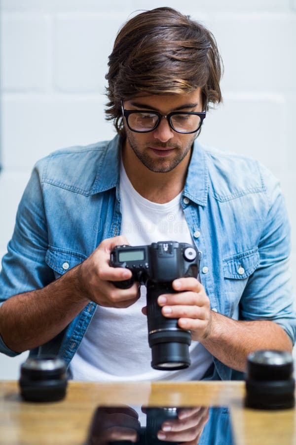 Man Holding Camera in Office Stock Photo - Image of businessman, office ...