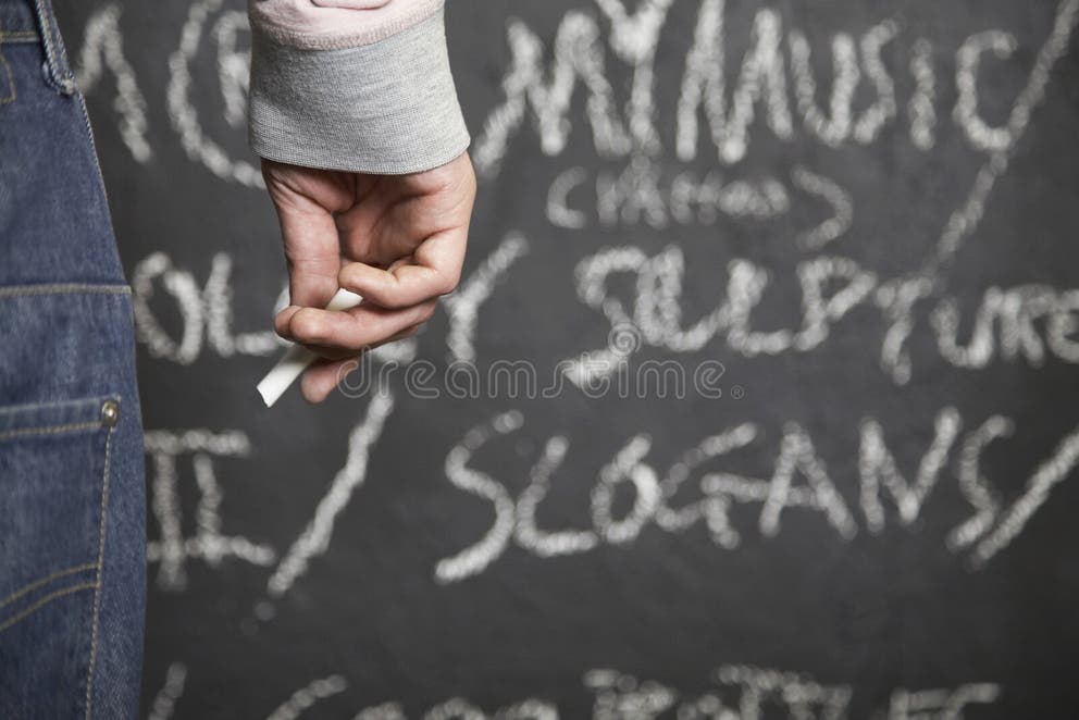 Man Holding Chalk in Front of Blackboard Stock Photo - Image of student ...